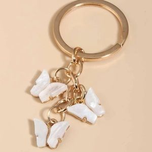 Anthropologie | Accessories | 2 New White Butterfly Pendant Keychain ...